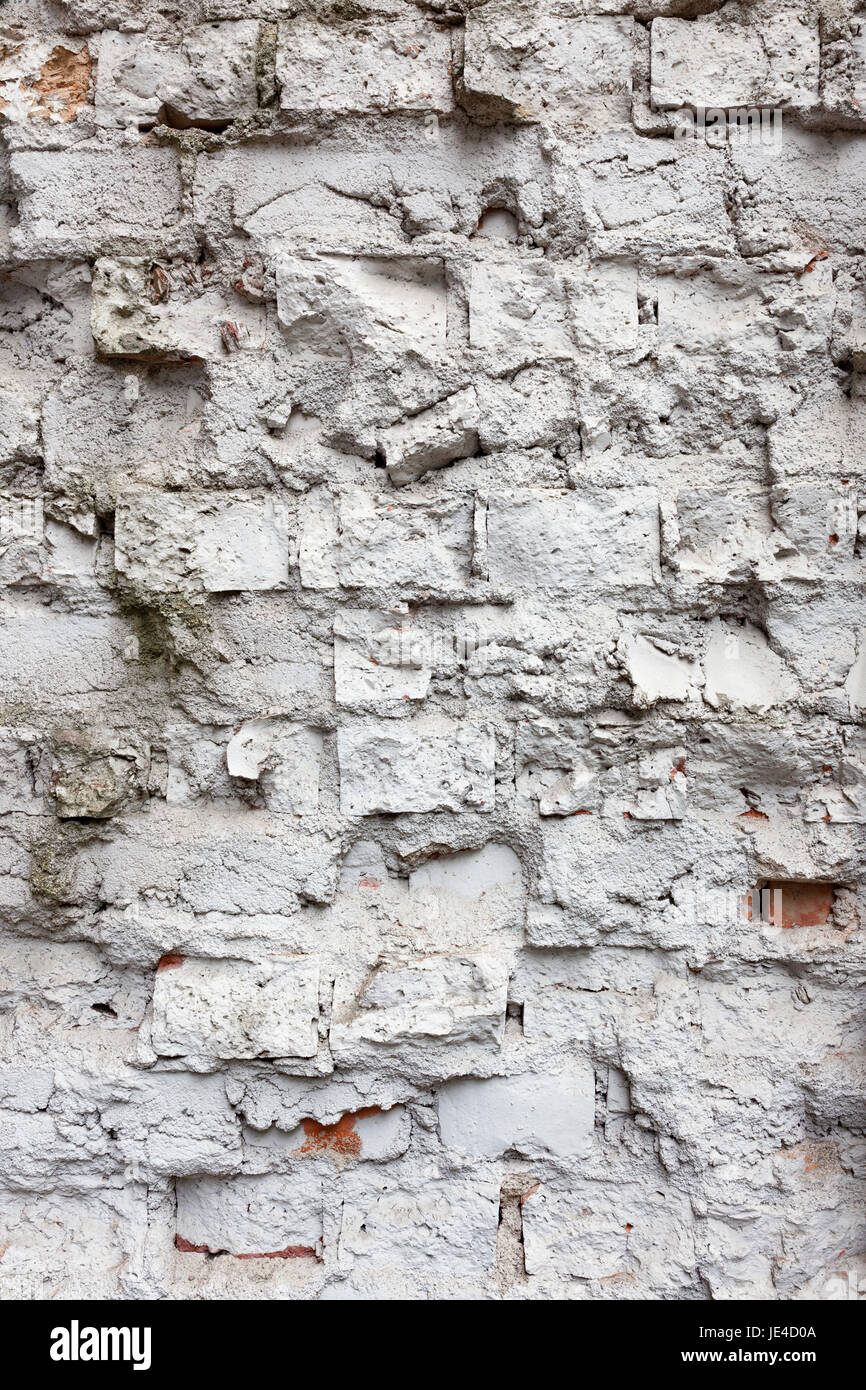 Broken old white brick wall closeup background Stock Photo - Alamy