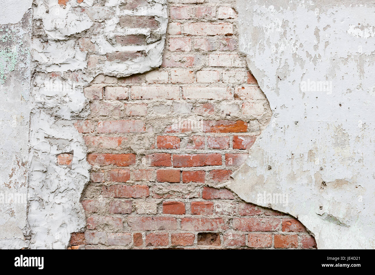 Aged brick wall with cracked plaster background Stock Photo - Alamy