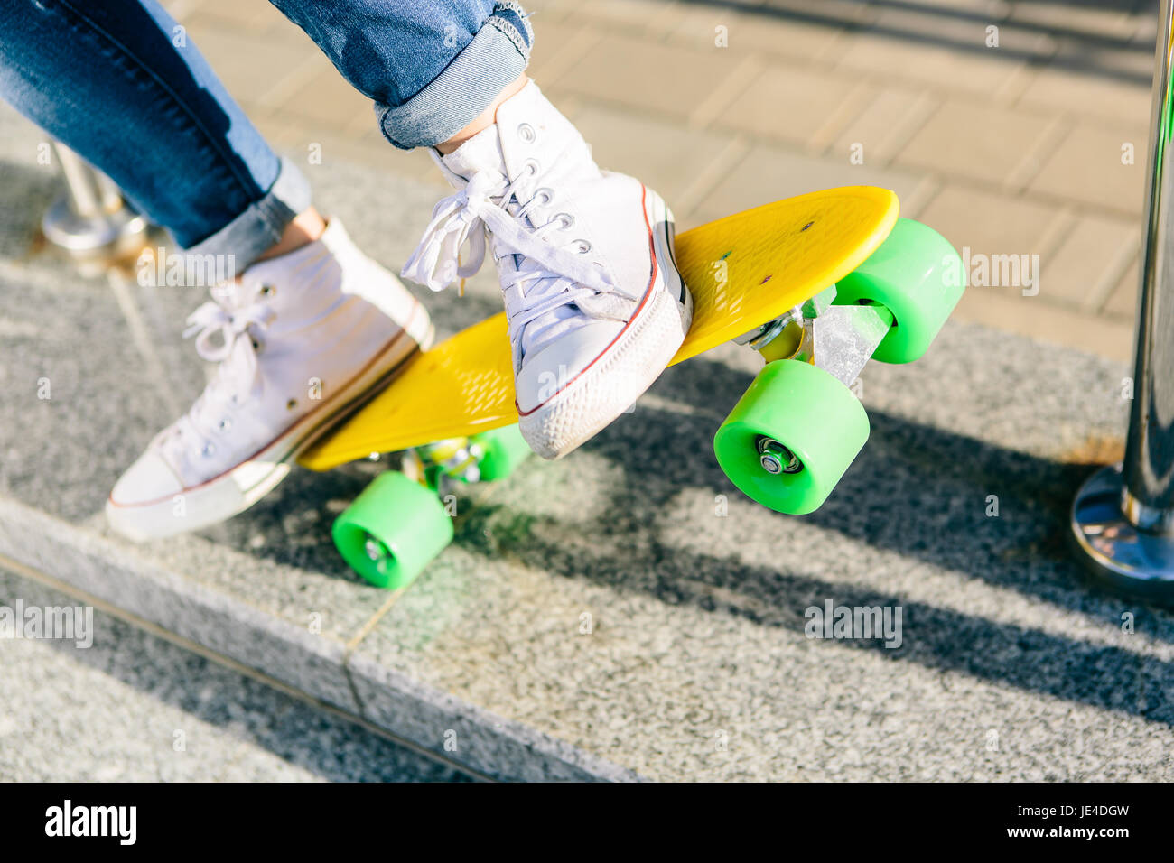Brunette Girl Riding Penny Board