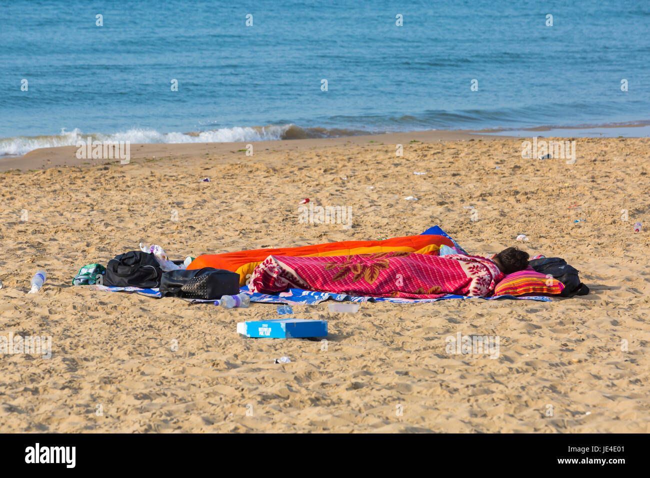 Man sleeping on beach hi-res stock photography and images - Alamy