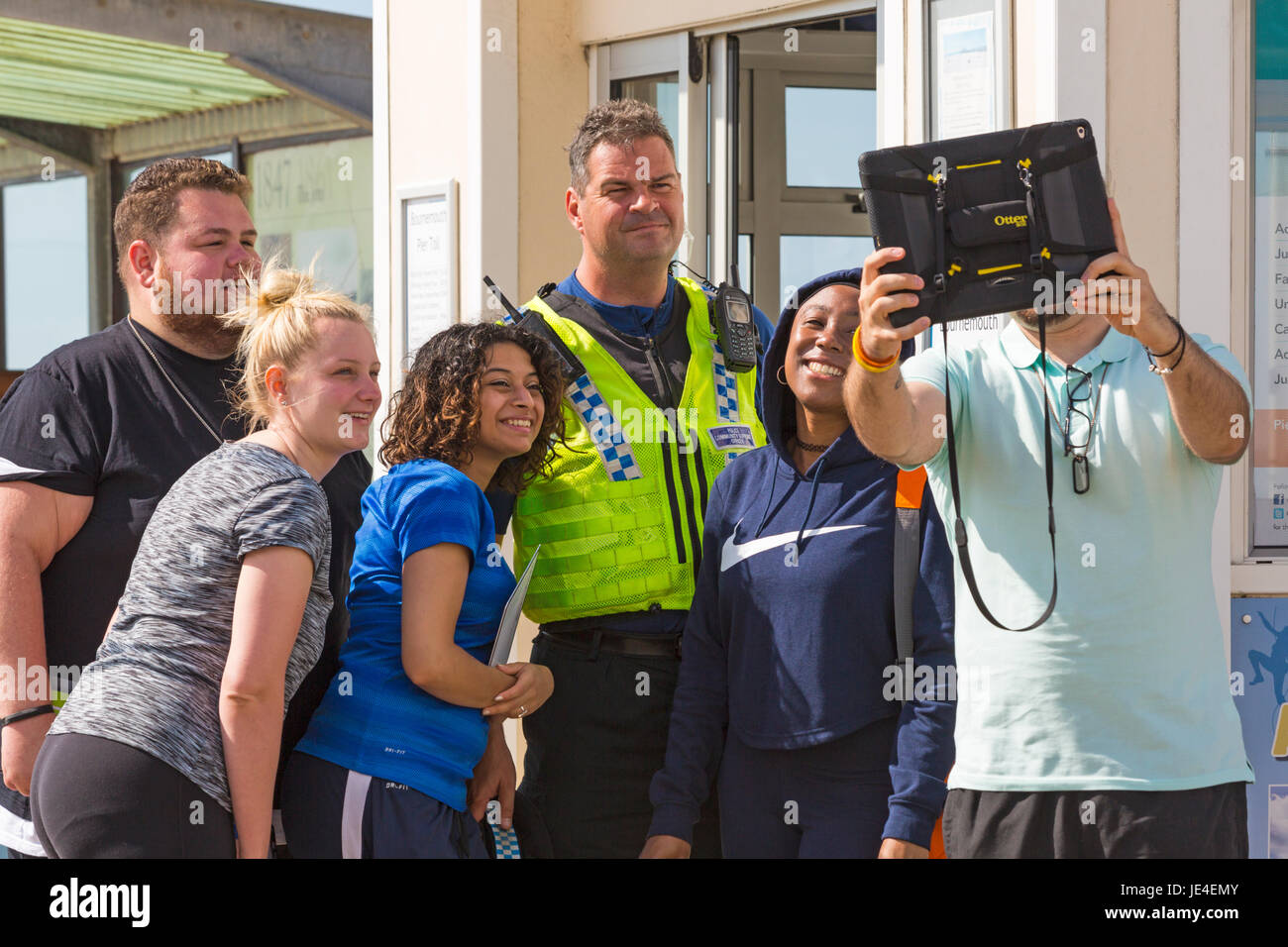 Students posing for photo with Police Community Support Officer on ...
