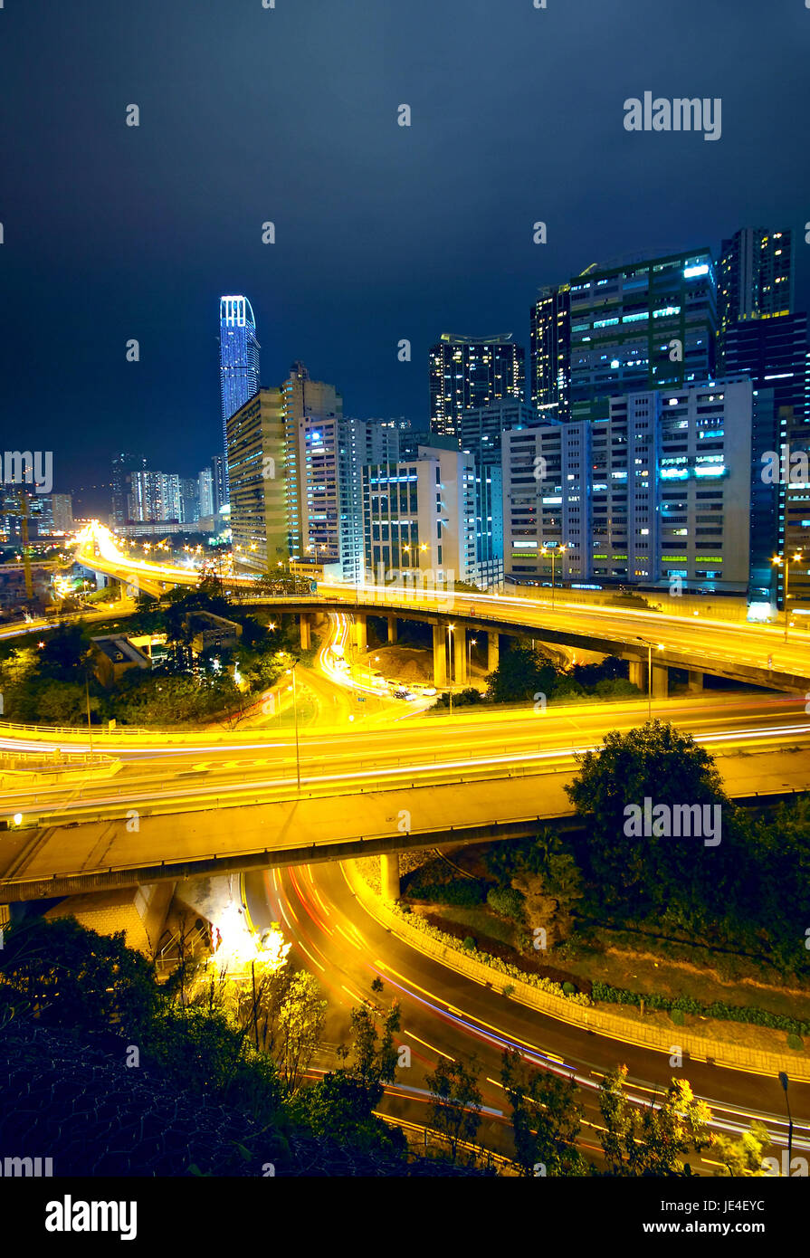 Colorful city night with buildings and bridge Stock Photo - Alamy