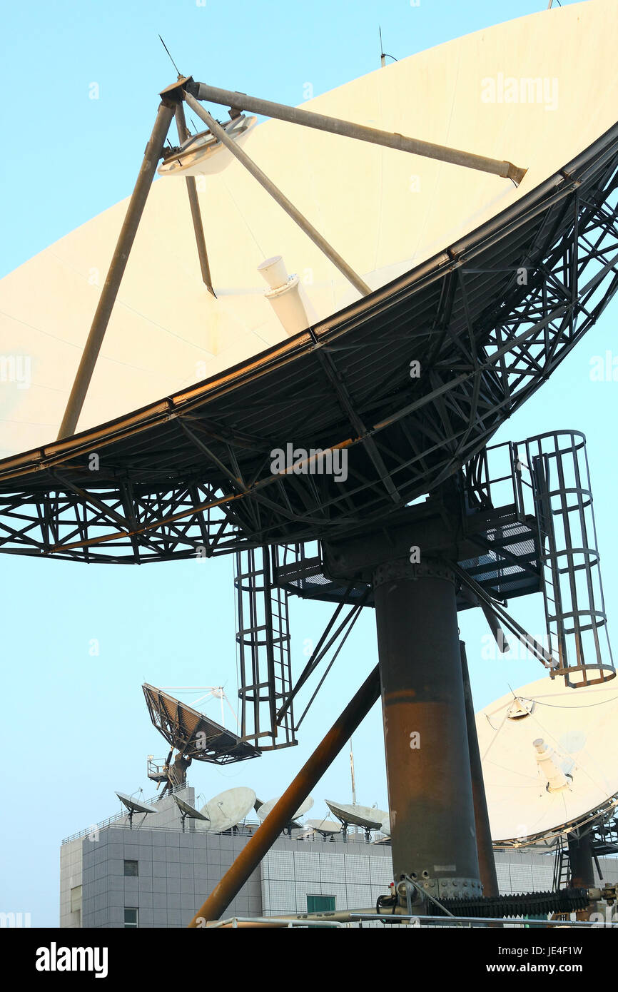 Satellite Communications Dishes on top of TV Station Stock Photo - Alamy
