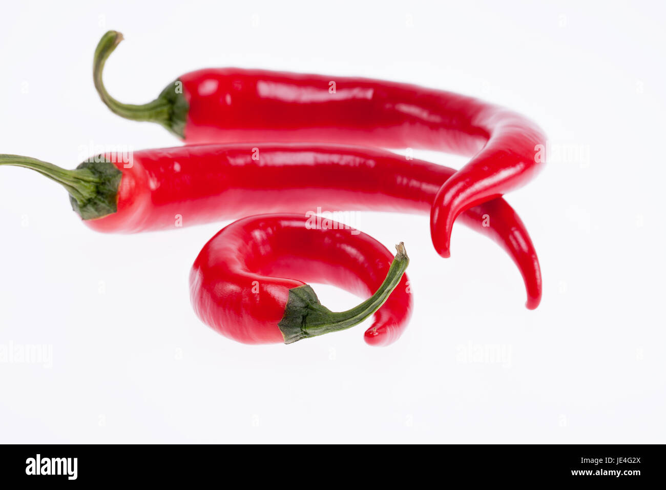 red peperoni peppers isolated on white background Stock Photo - Alamy
