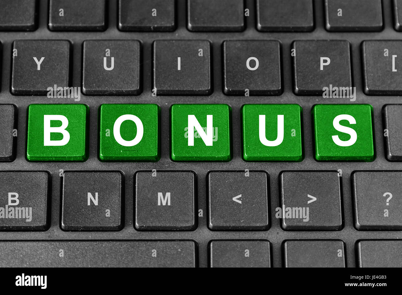 bonus green word on keyboard, business concept Stock Photo - Alamy