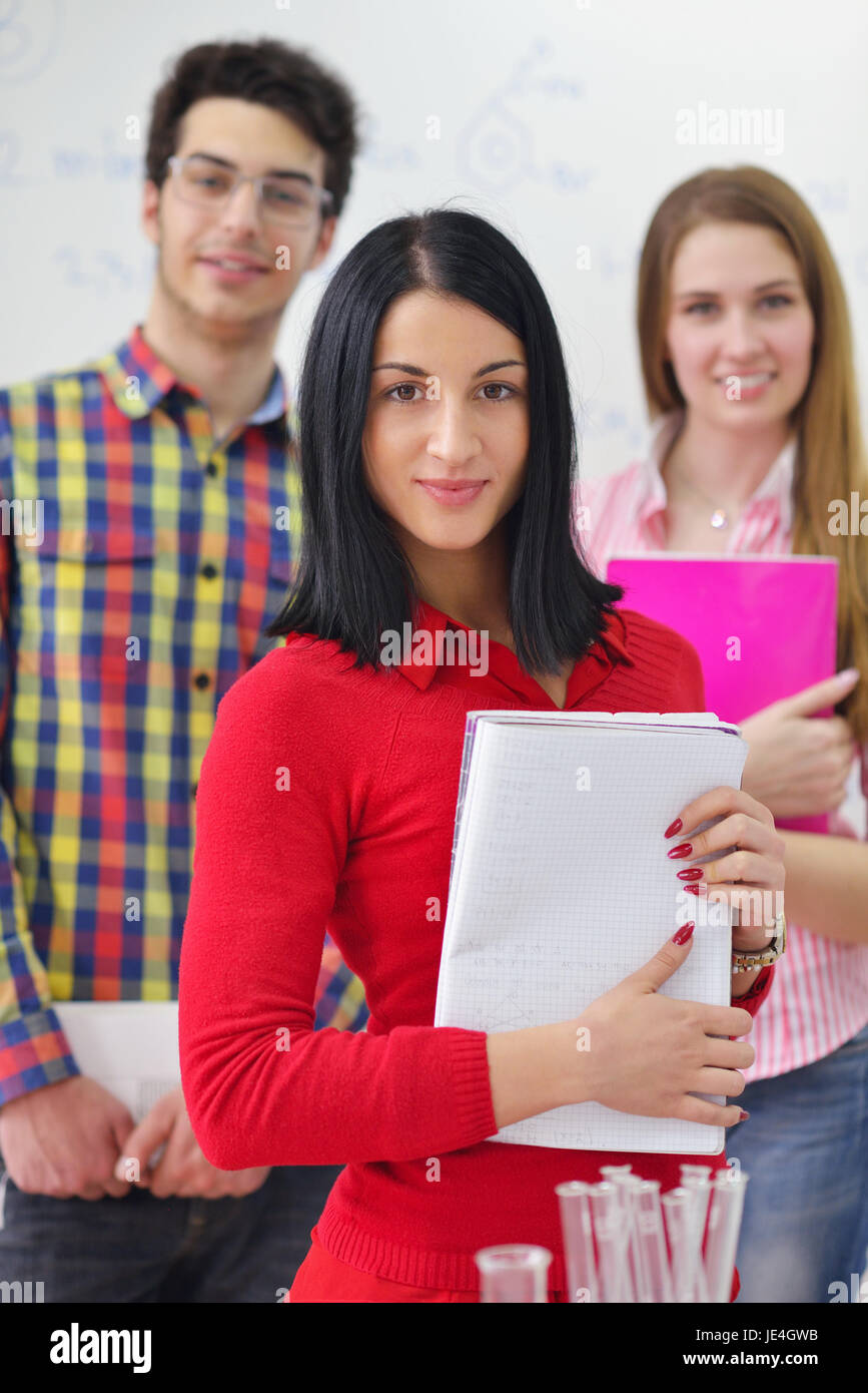 happy young teens group in school have fun an learning lessons Stock ...