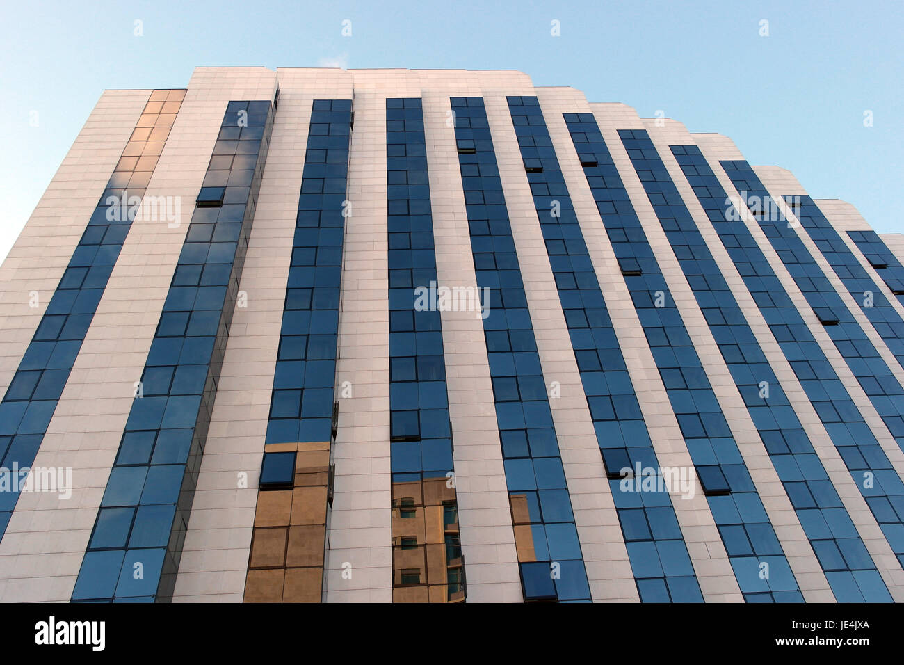 Modern mirrored building Stock Photo - Alamy
