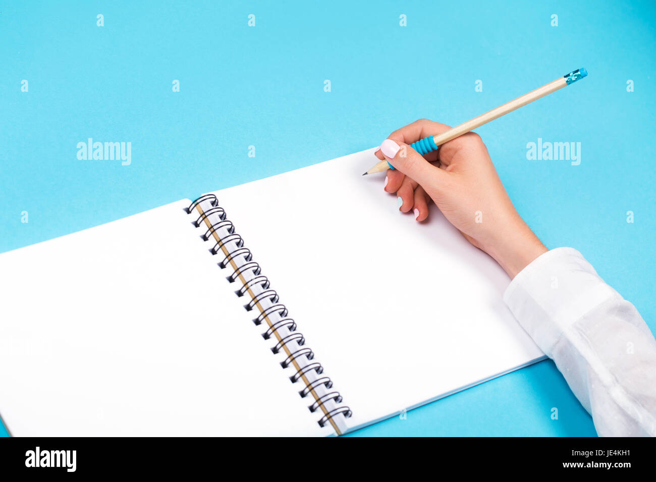 Spiral notepad with pencil as mockup for design Stock Photo - Alamy