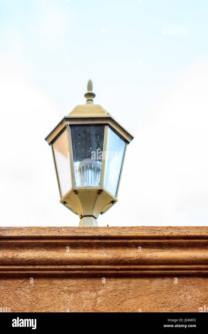 old lamp on the wall, retro background Stock Photo - Alamy