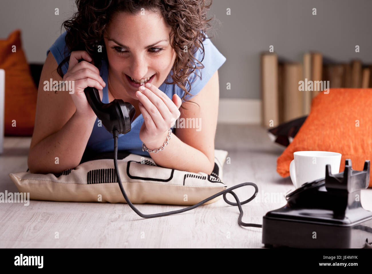 young woman chatting and doing gossip in her room Stock Photo - Alamy