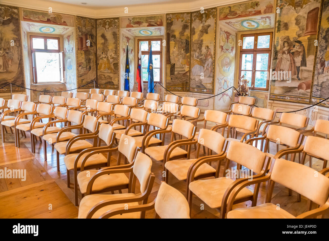 Interior of empty luxury conference room with medieval frescoes on the ...