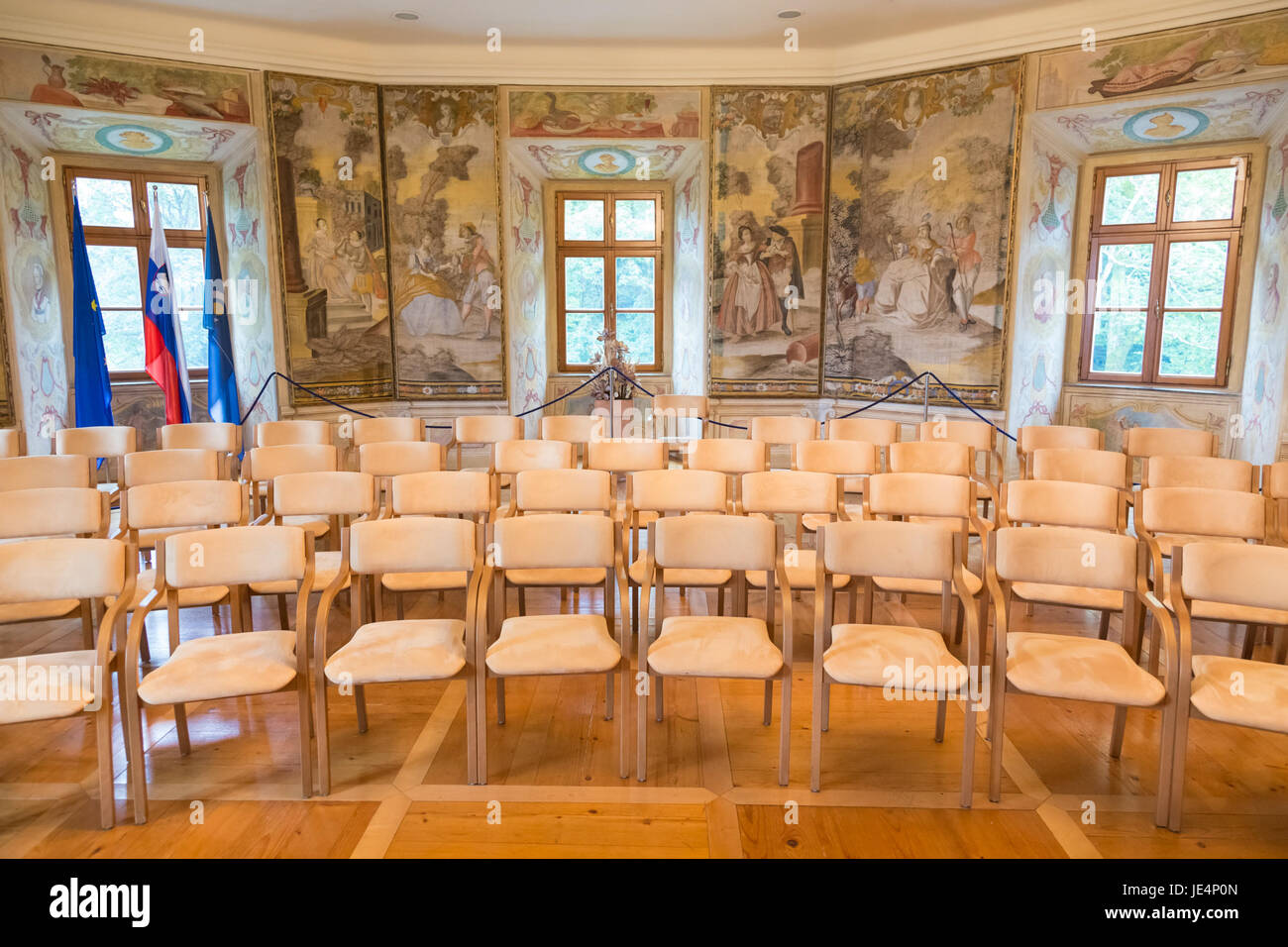 Interior of empty luxury conference room with medieval frescoes on the ...