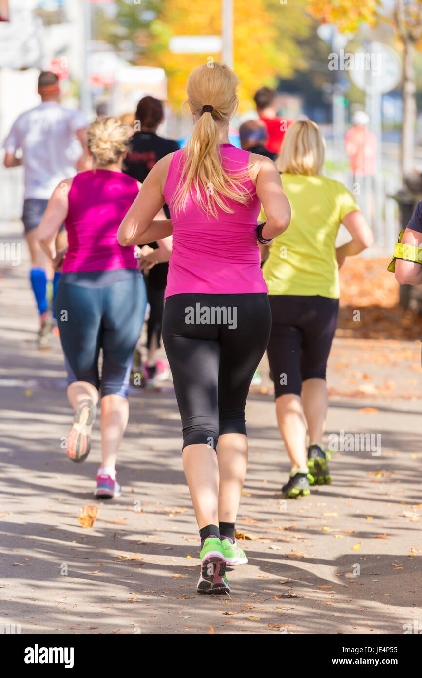 Group of active people running in the city. Healthy lifestyle. Weight ...