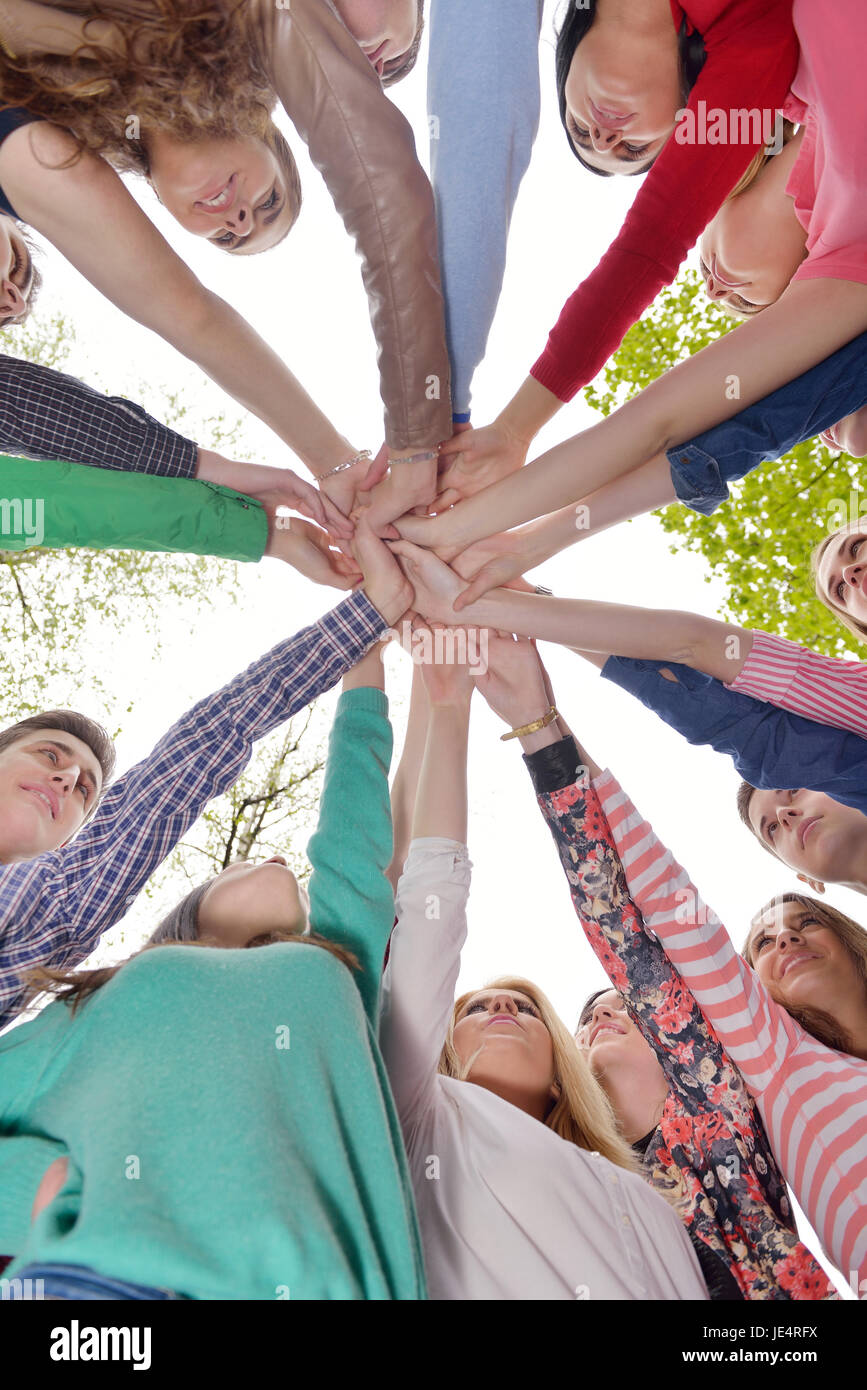 Happy smiling group of young friends staying together outdoor in the ...