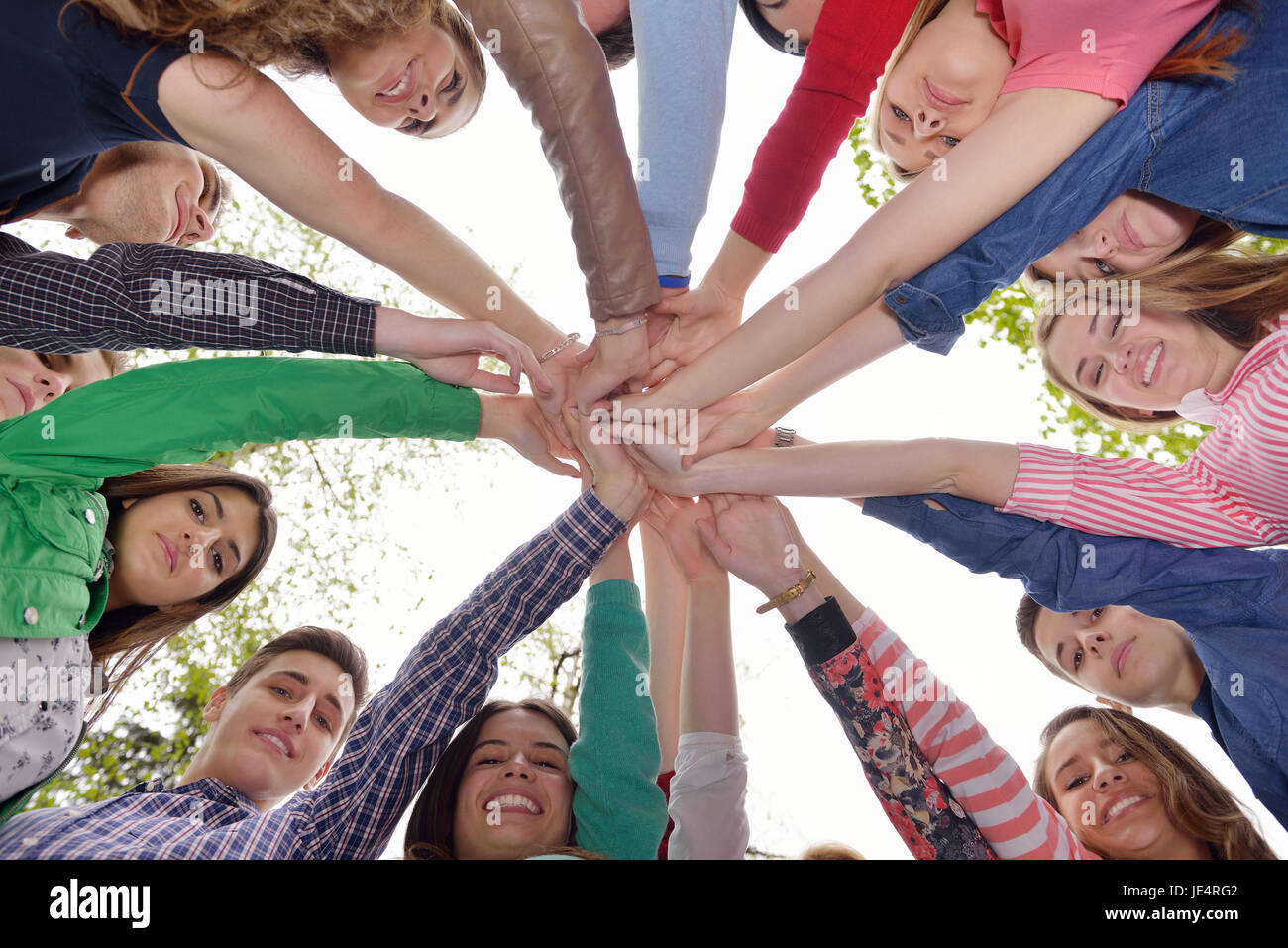 Happy smiling group of young friends staying together outdoor in the ...