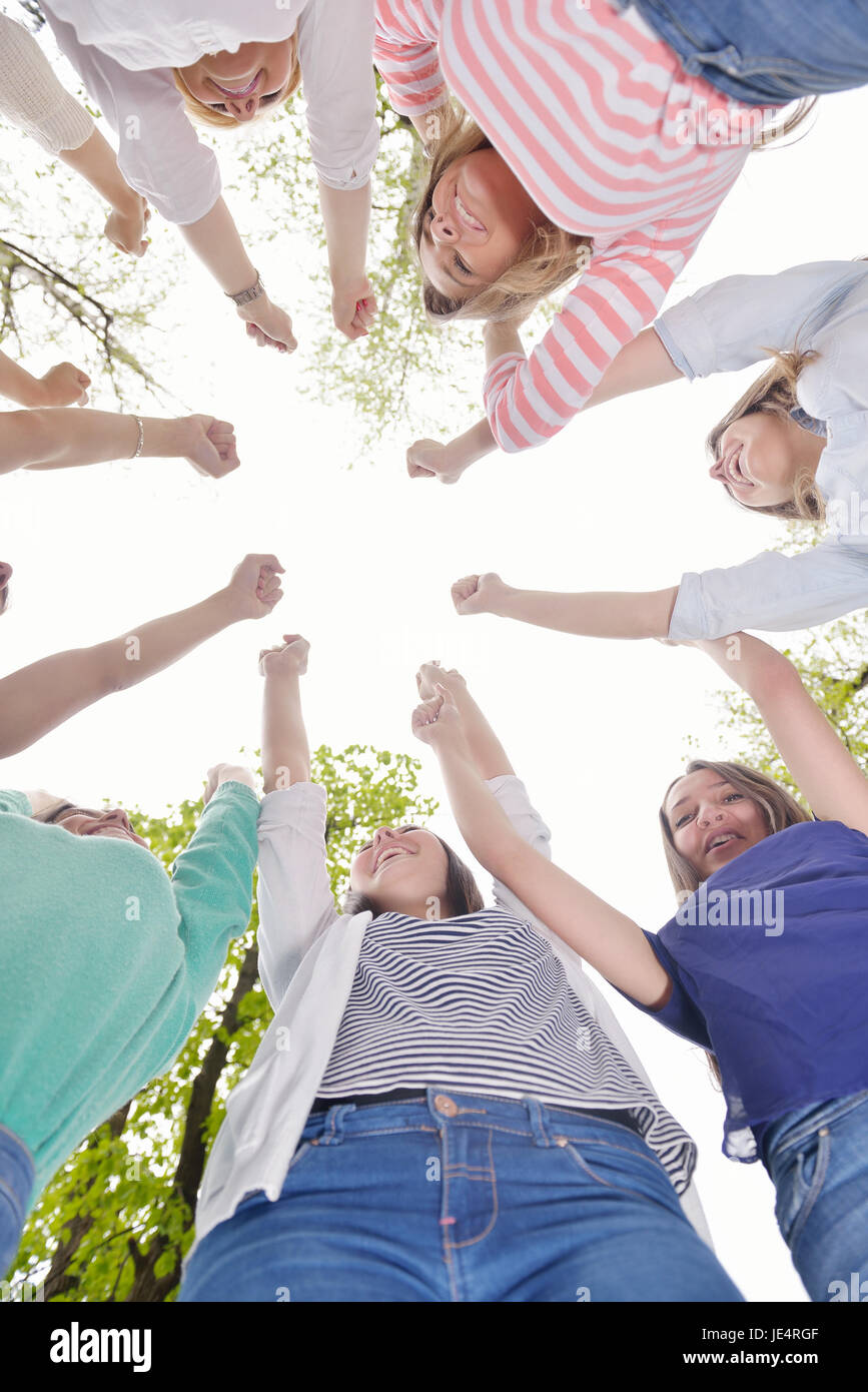 Happy smiling group of young friends staying together outdoor in the ...