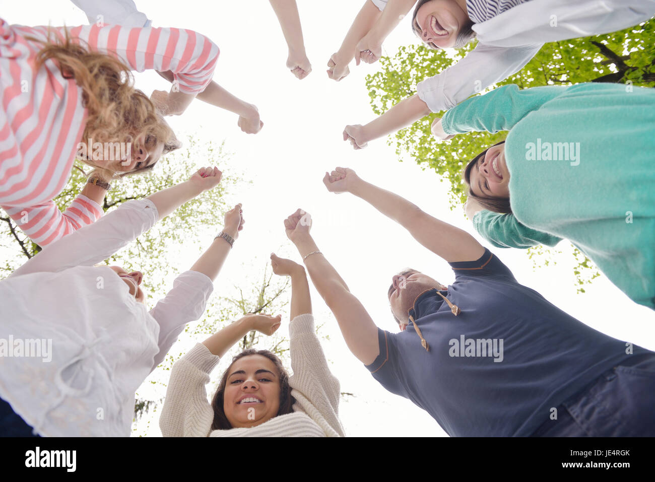 Happy smiling group of young friends staying together outdoor in the ...
