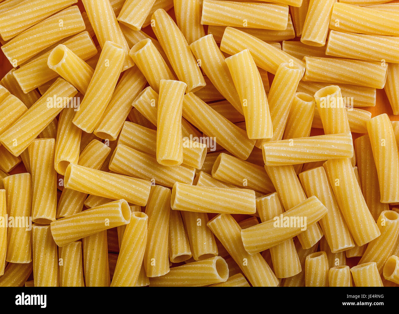 Italian tortiglioni pasta raw food background Stock Photo - Alamy