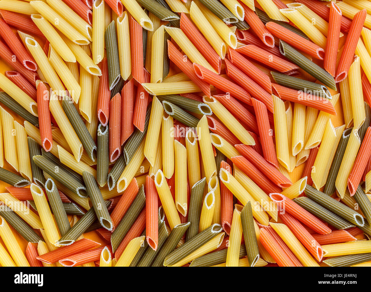 Colourful penne pasta, raw food background Stock Photo - Alamy