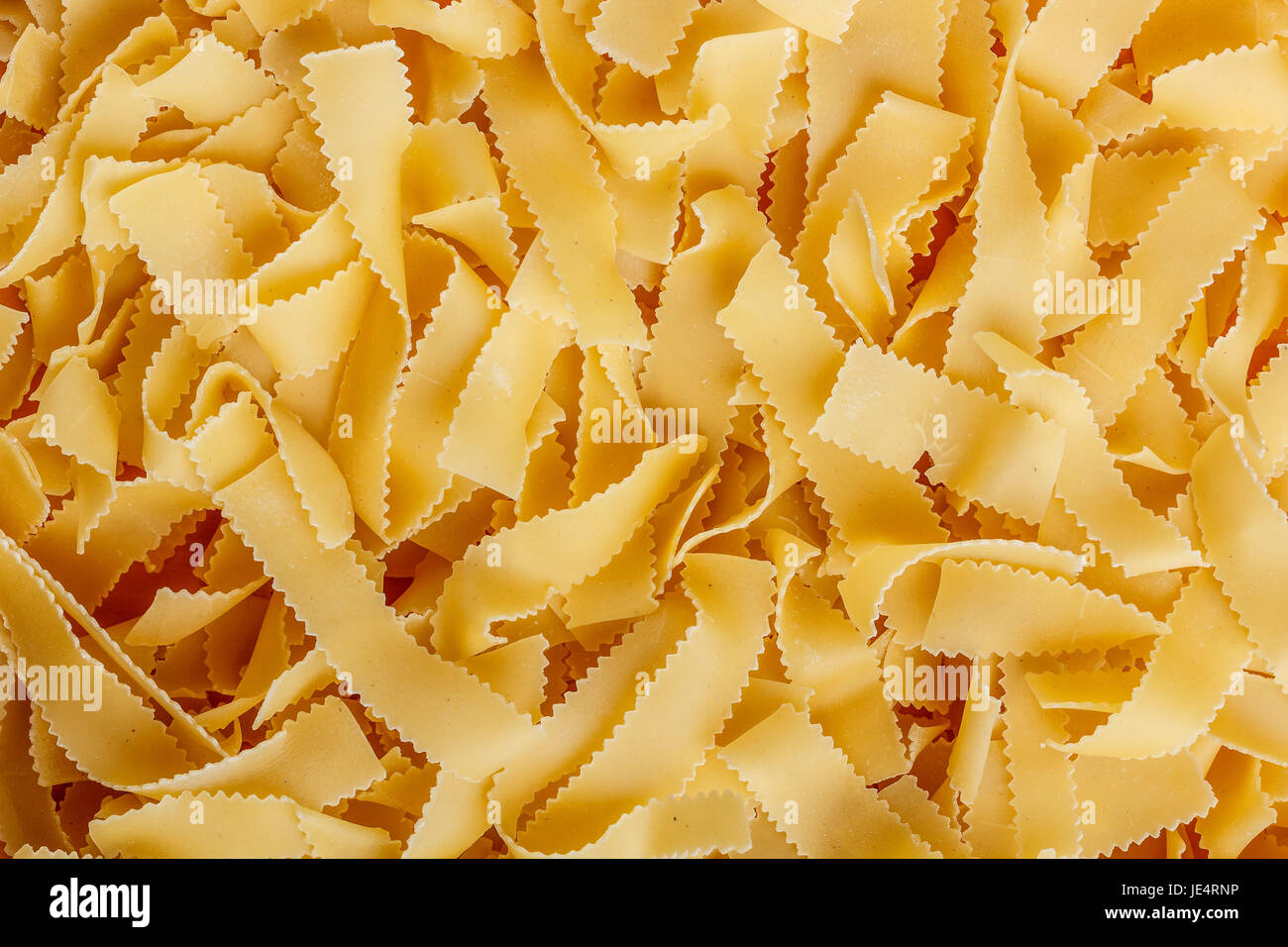 Pappardelle background, italian dry pasta Stock Photo - Alamy