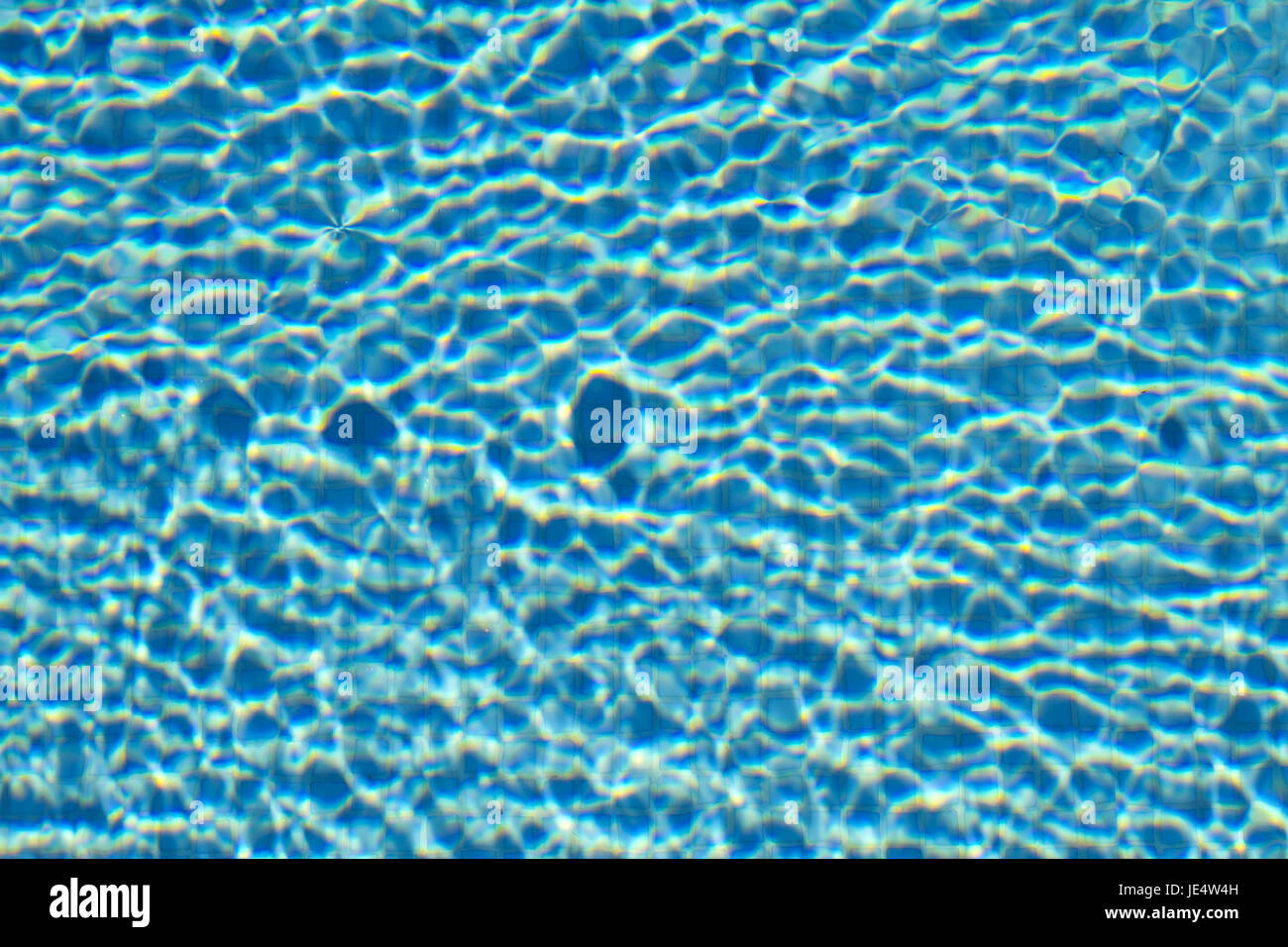 Water on a tiled swimming pool background Stock Photo - Alamy