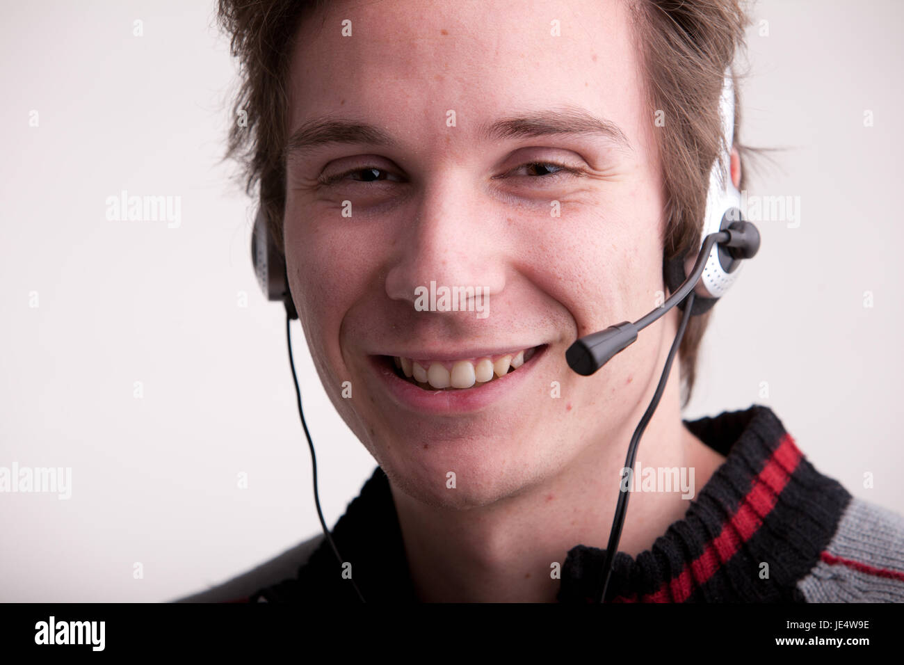 call center young man with a headset Stock Photo - Alamy