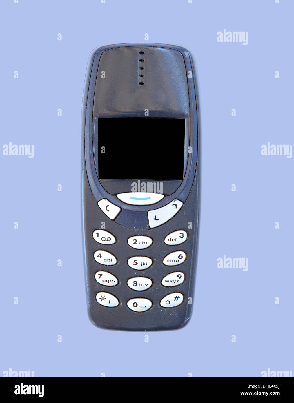 Old grey mobile on a blue background Stock Photo - Alamy
