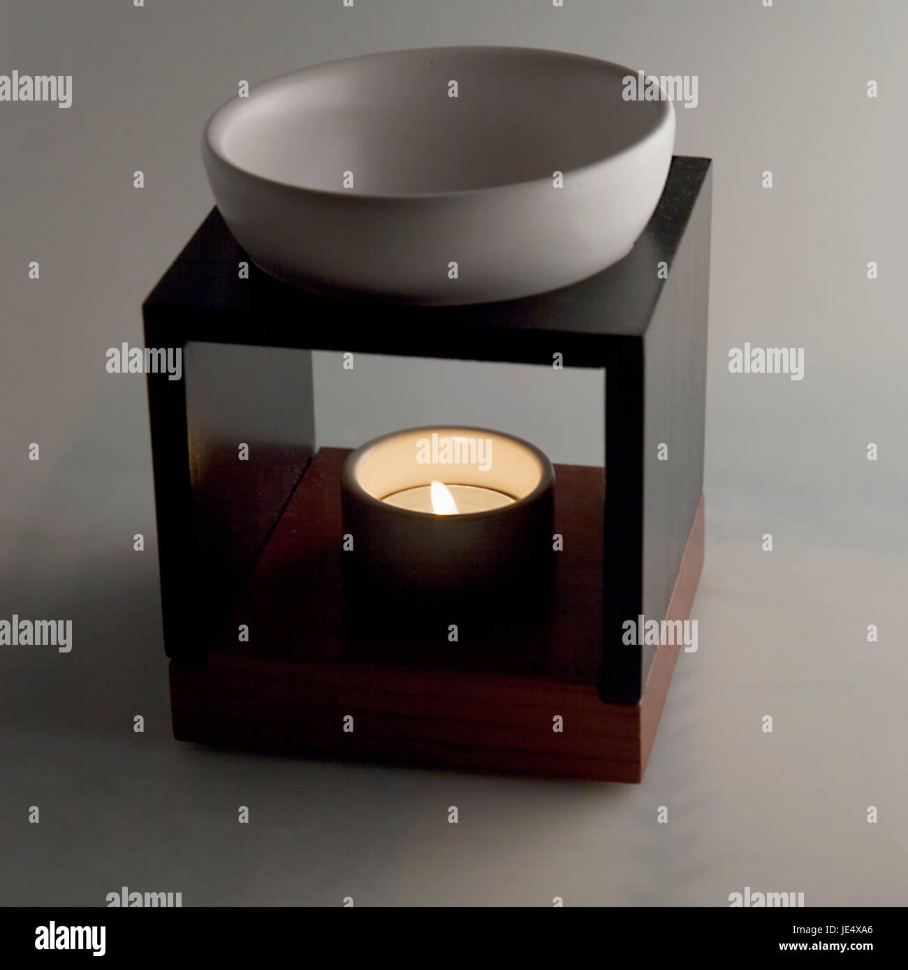 Scent diffuser over gray background, square image Stock Photo - Alamy