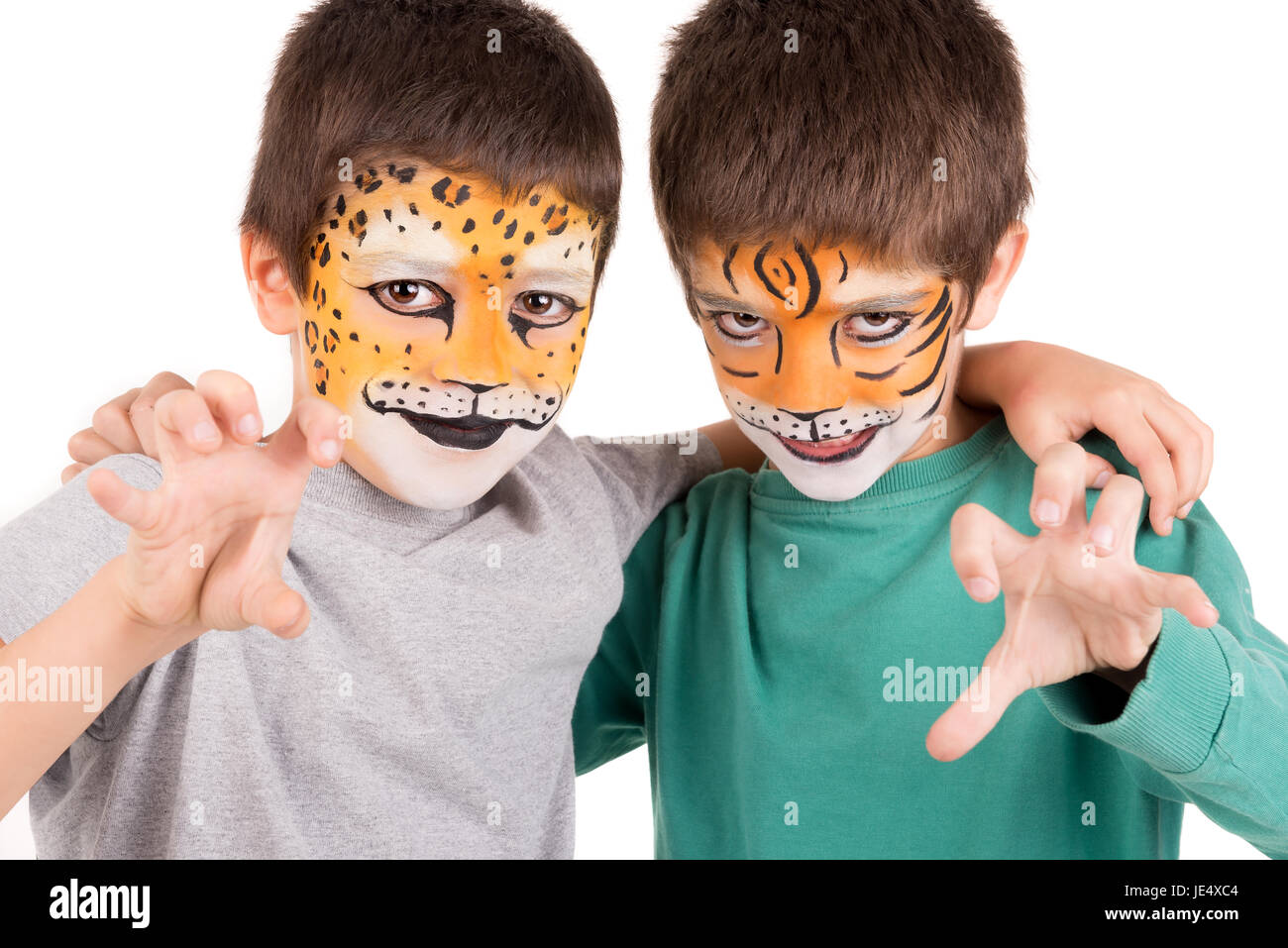 Boys with face-painted like a leopard and tiger isolated in white Stock ...