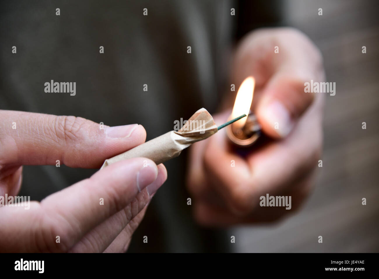 Lighting a firecracker hi-res stock photography and images - Alamy