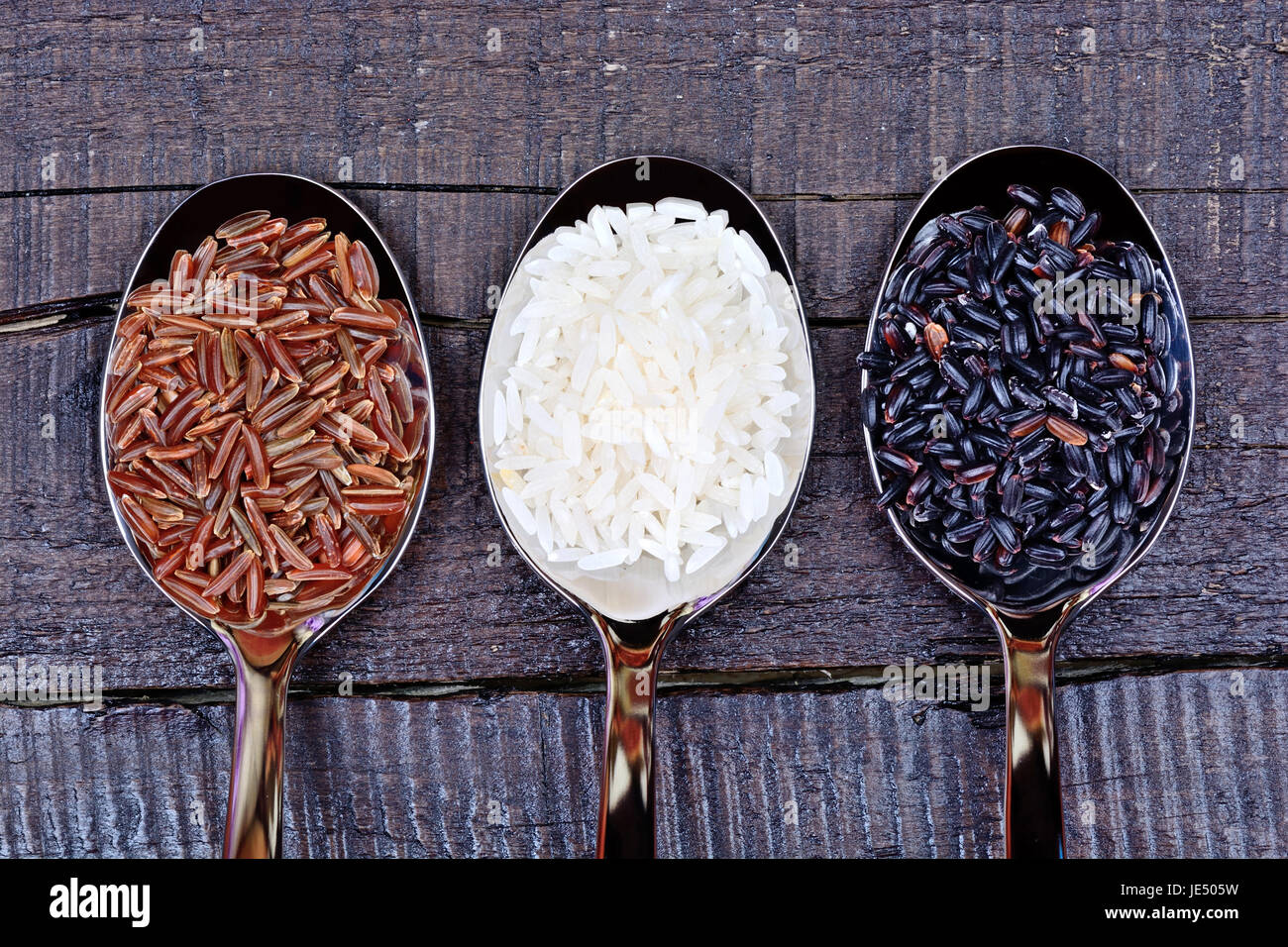 Different types of rice in a spoon on table Stock Photo - Alamy