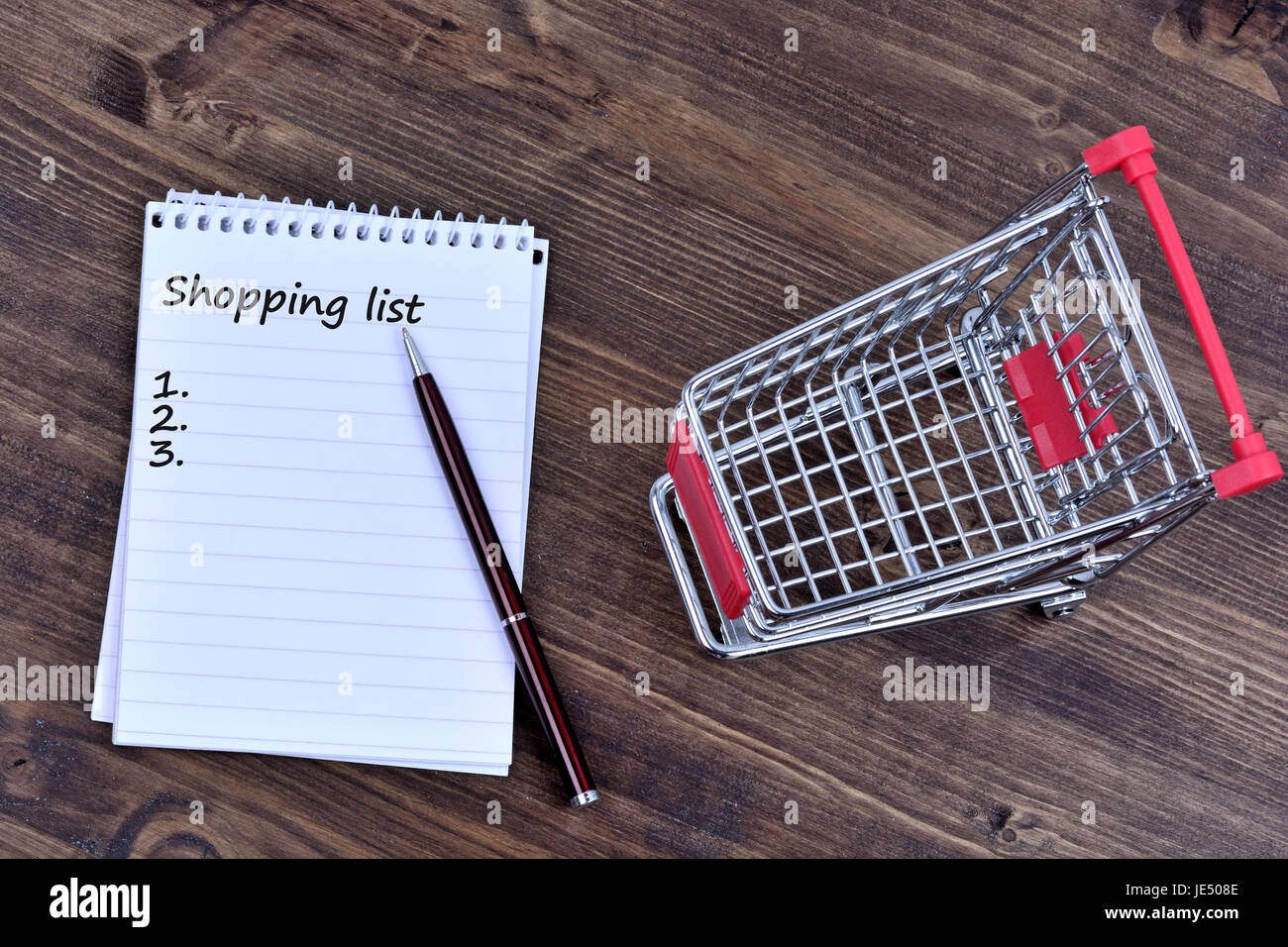 Shopping list words on notebook page Stock Photo - Alamy