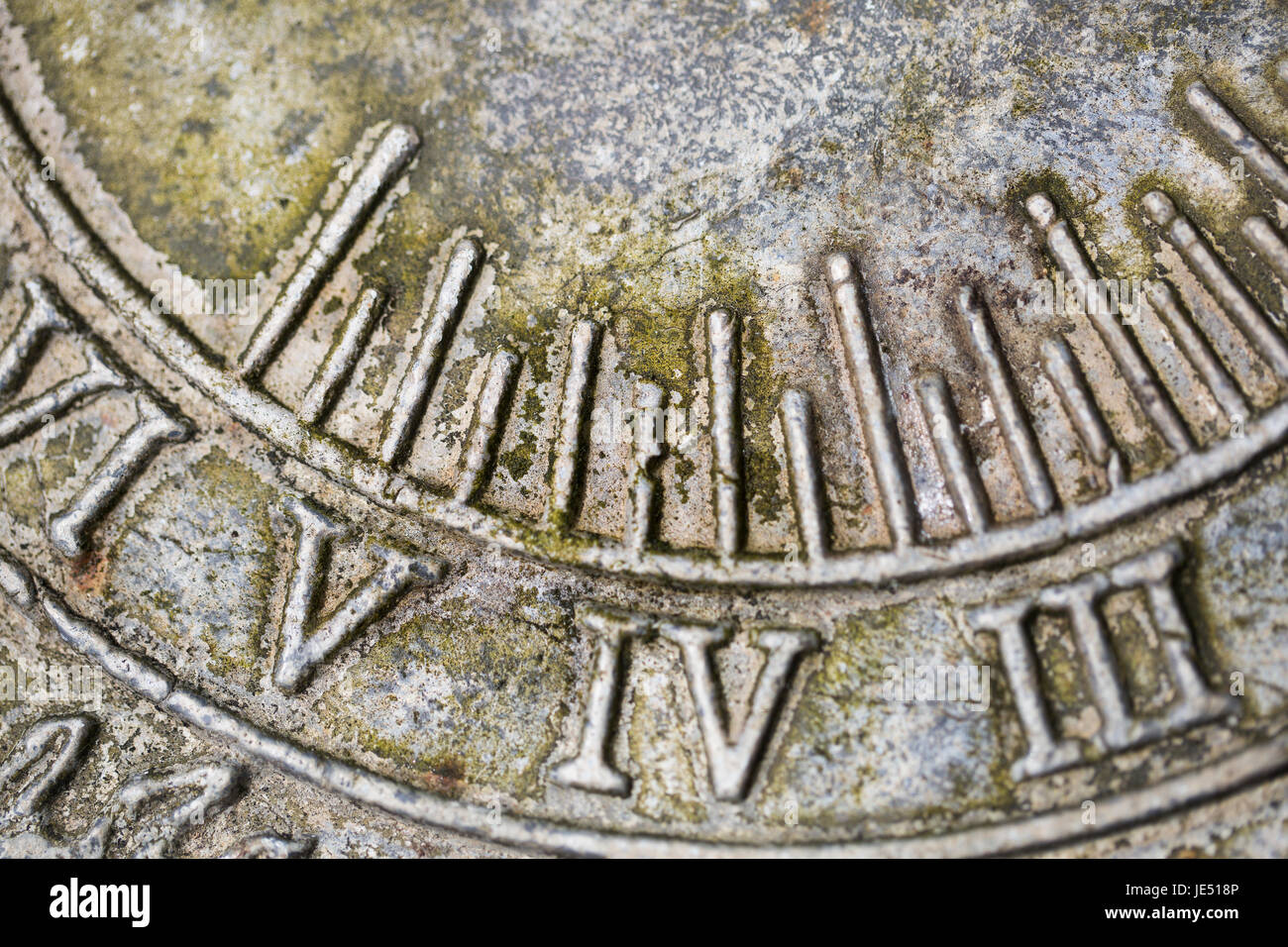 Close up of Roman numerals on weathered sundial Stock Photo - Alamy