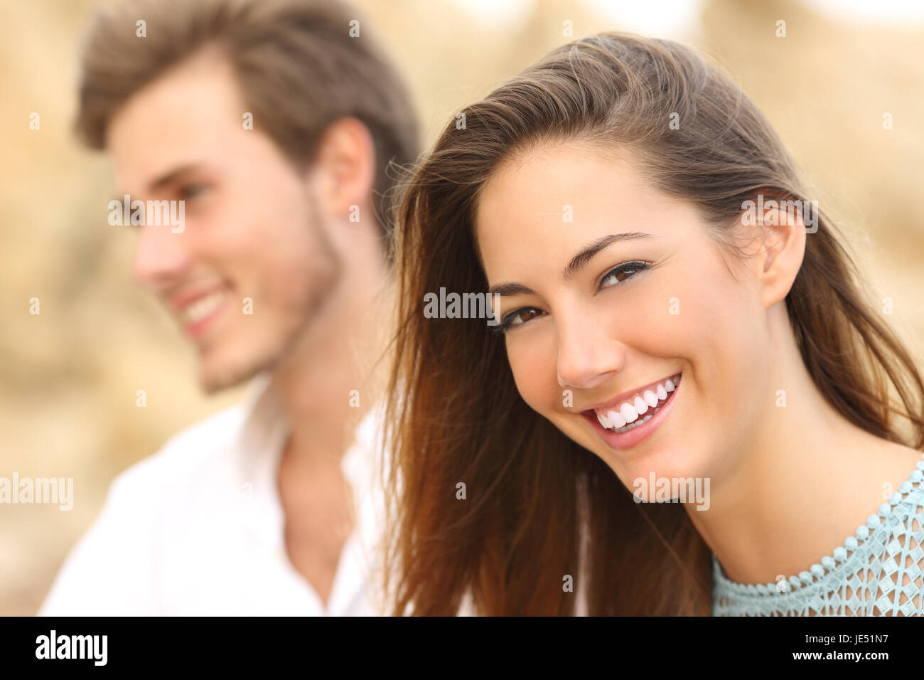 Happy beautiful girl with white smile posing and looking at you with an ...