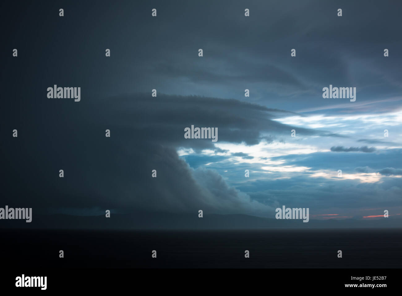 Gathering storm clouds in a vast landscape Stock Photo - Alamy