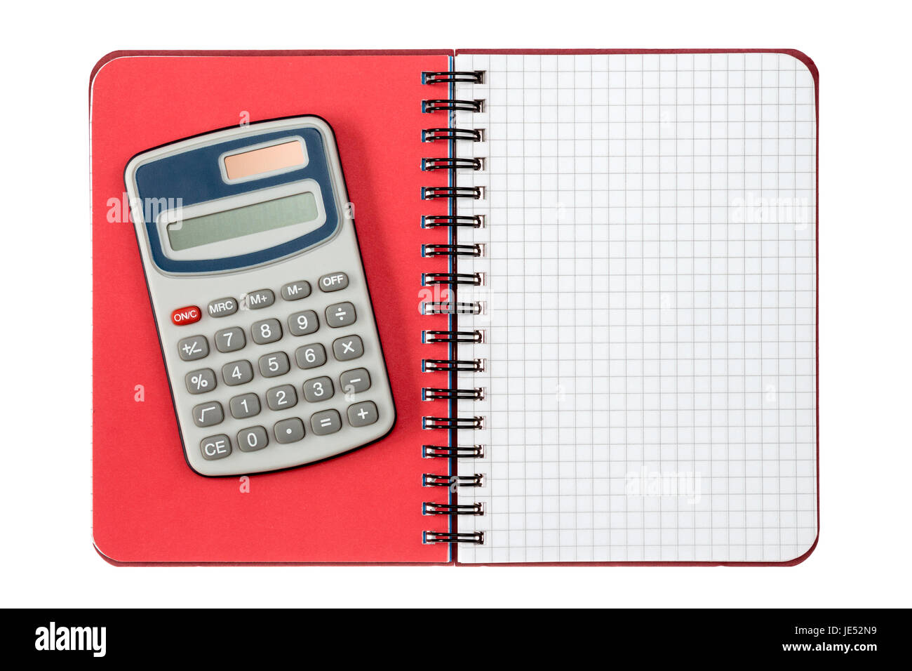 Digital calculator and spiral notebook ,isolated on white background ...