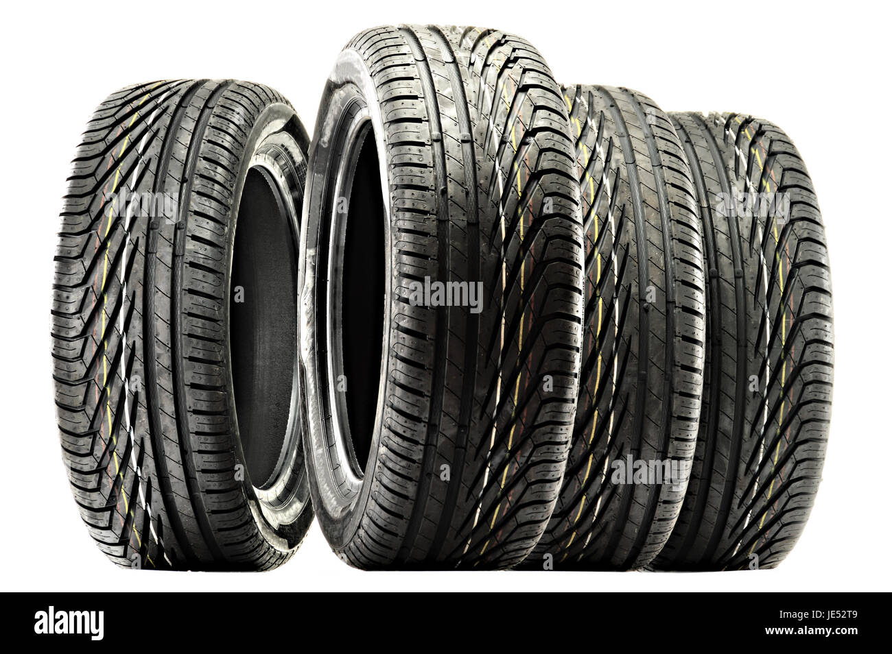 Four new black tires isolated on white background Stock Photo - Alamy