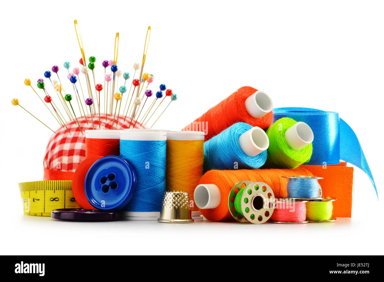 Composition with tailor threads over white background Stock Photo - Alamy