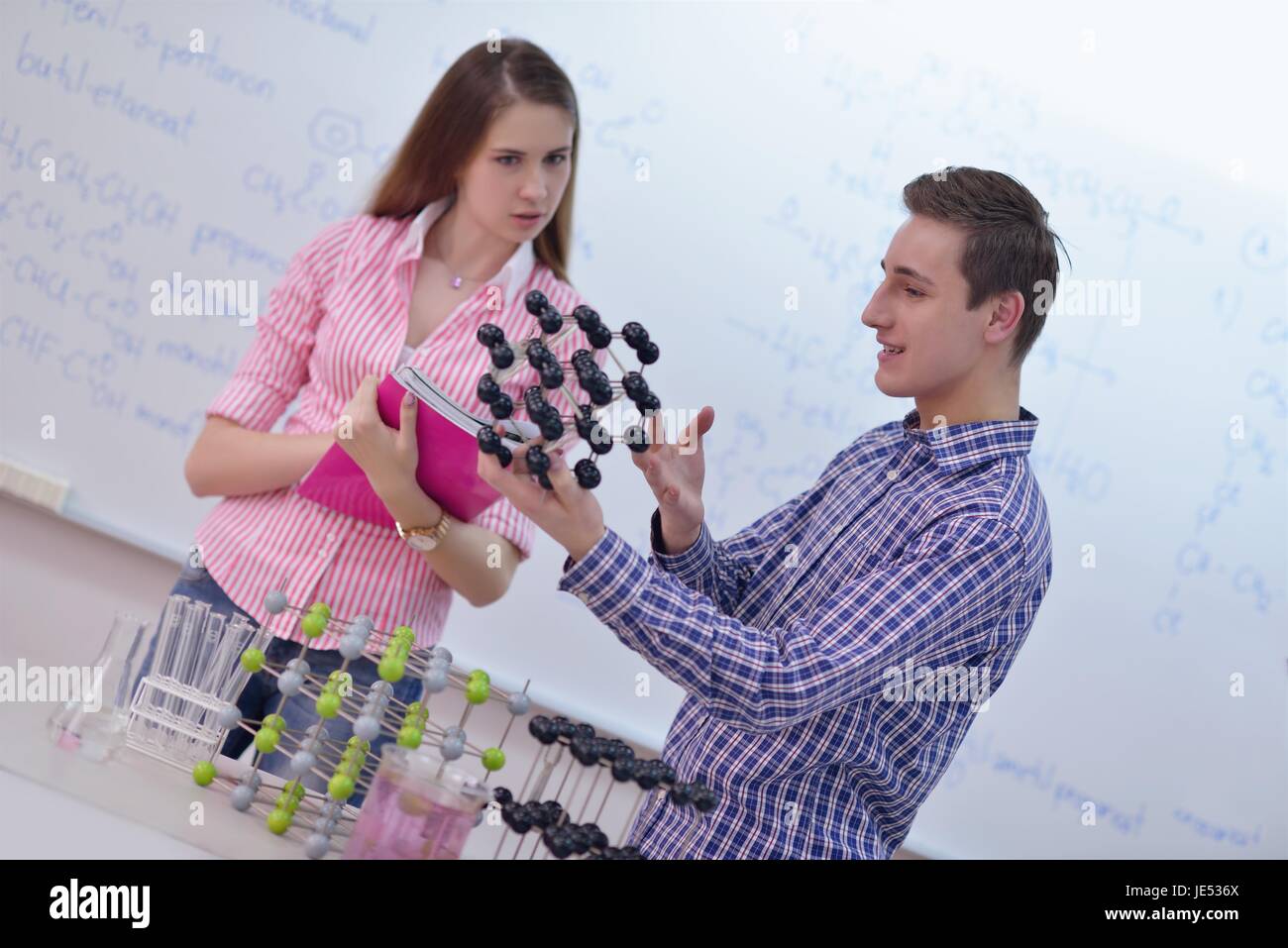 happy young teens group in school have fun an learning lessons Stock ...