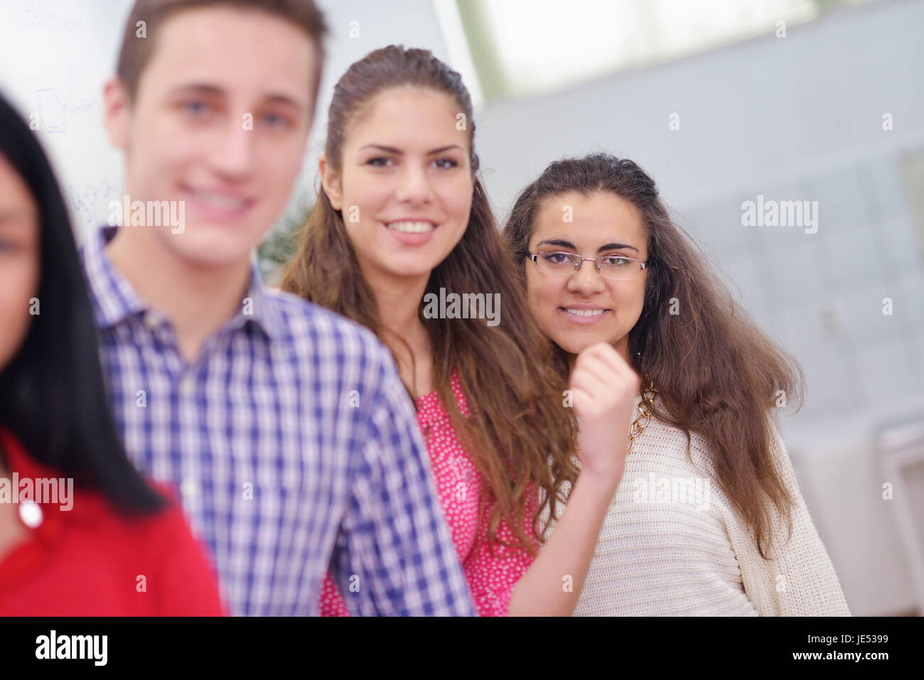 happy young teens group in school have fun an learning lessons Stock ...