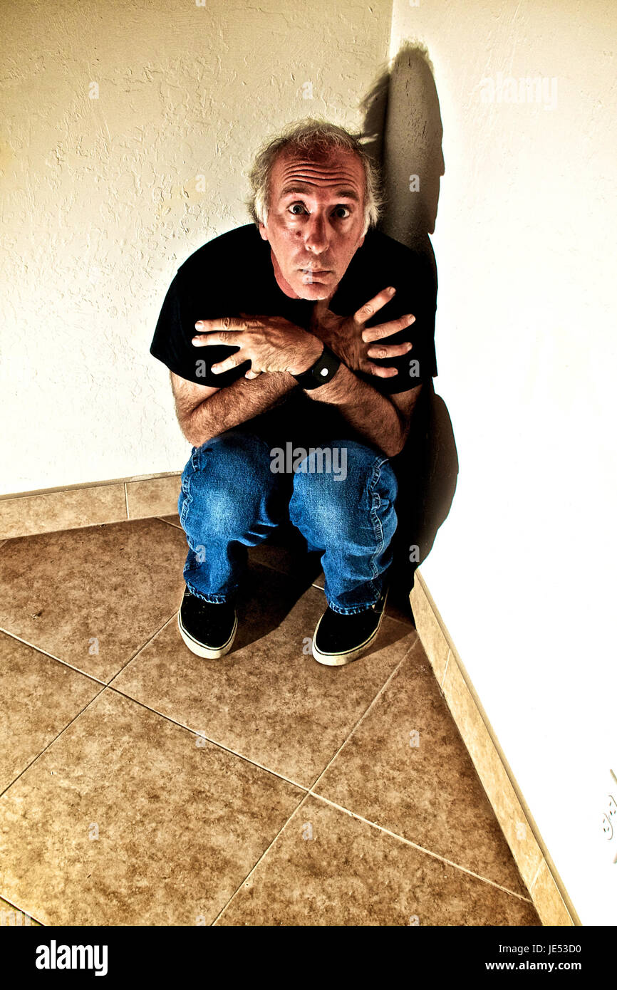 Hunched Down High Resolution Stock Photography and Images - Alamy