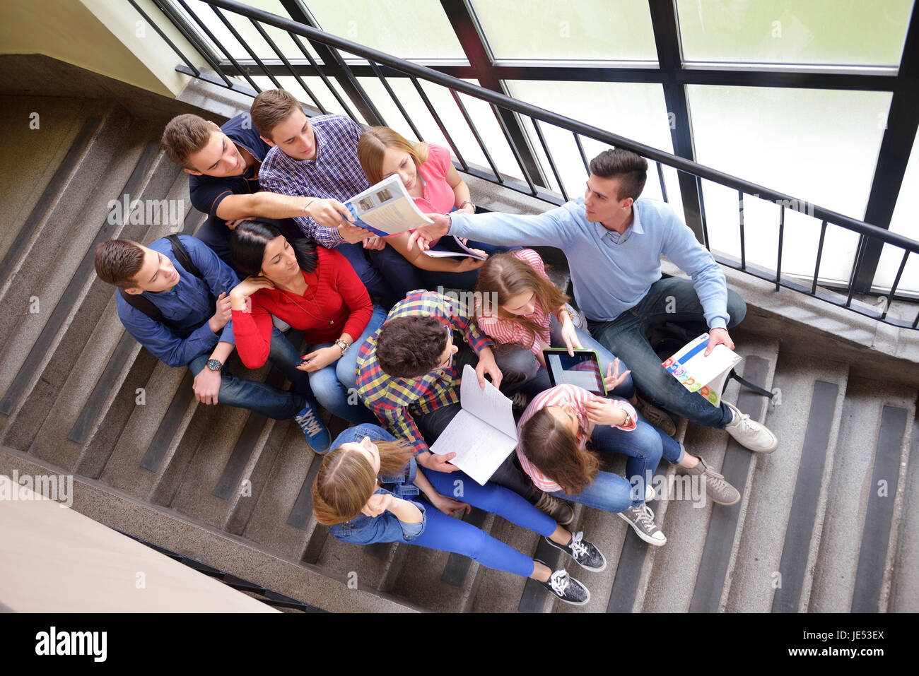 happy young teens group in school have fun an learning lessons Stock ...