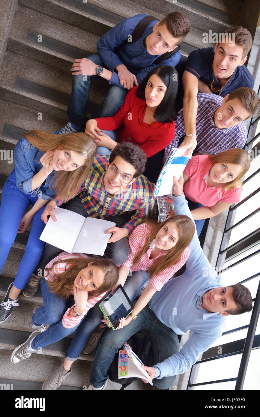 happy young teens group in school have fun an learning lessons Stock ...