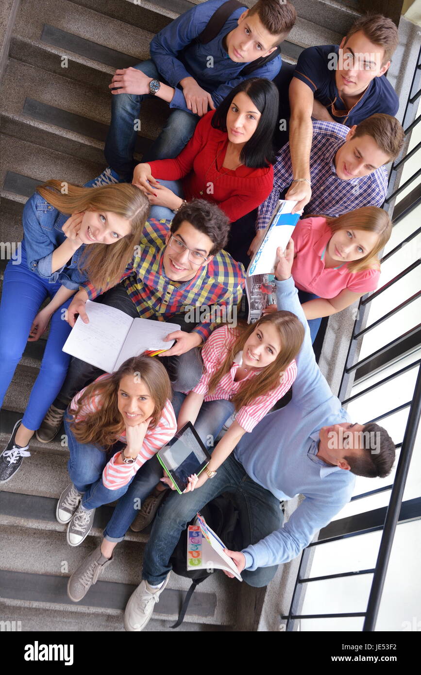 happy young teens group in school have fun an learning lessons Stock ...