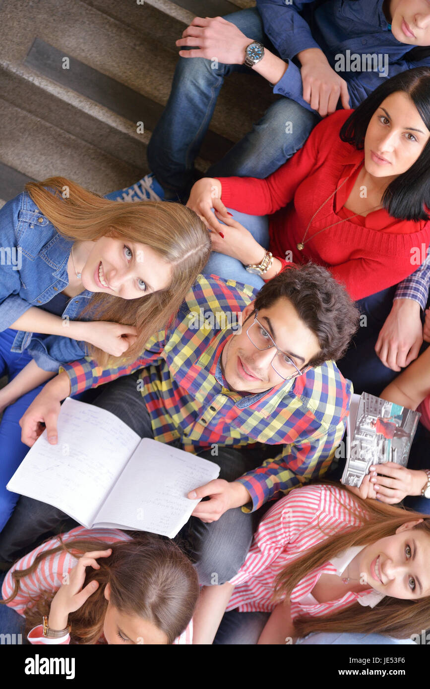 happy young teens group in school have fun an learning lessons Stock ...