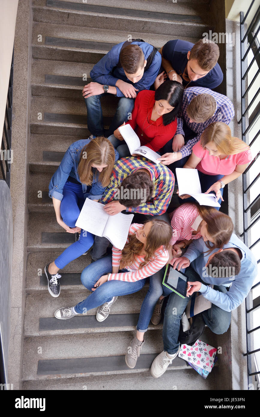 happy young teens group in school have fun an learning lessons Stock ...