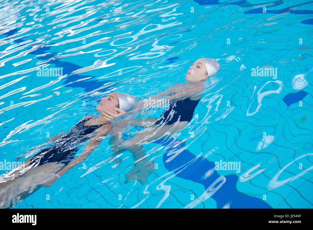 help and rescue action in swimming school at pool Stock Photo - Alamy