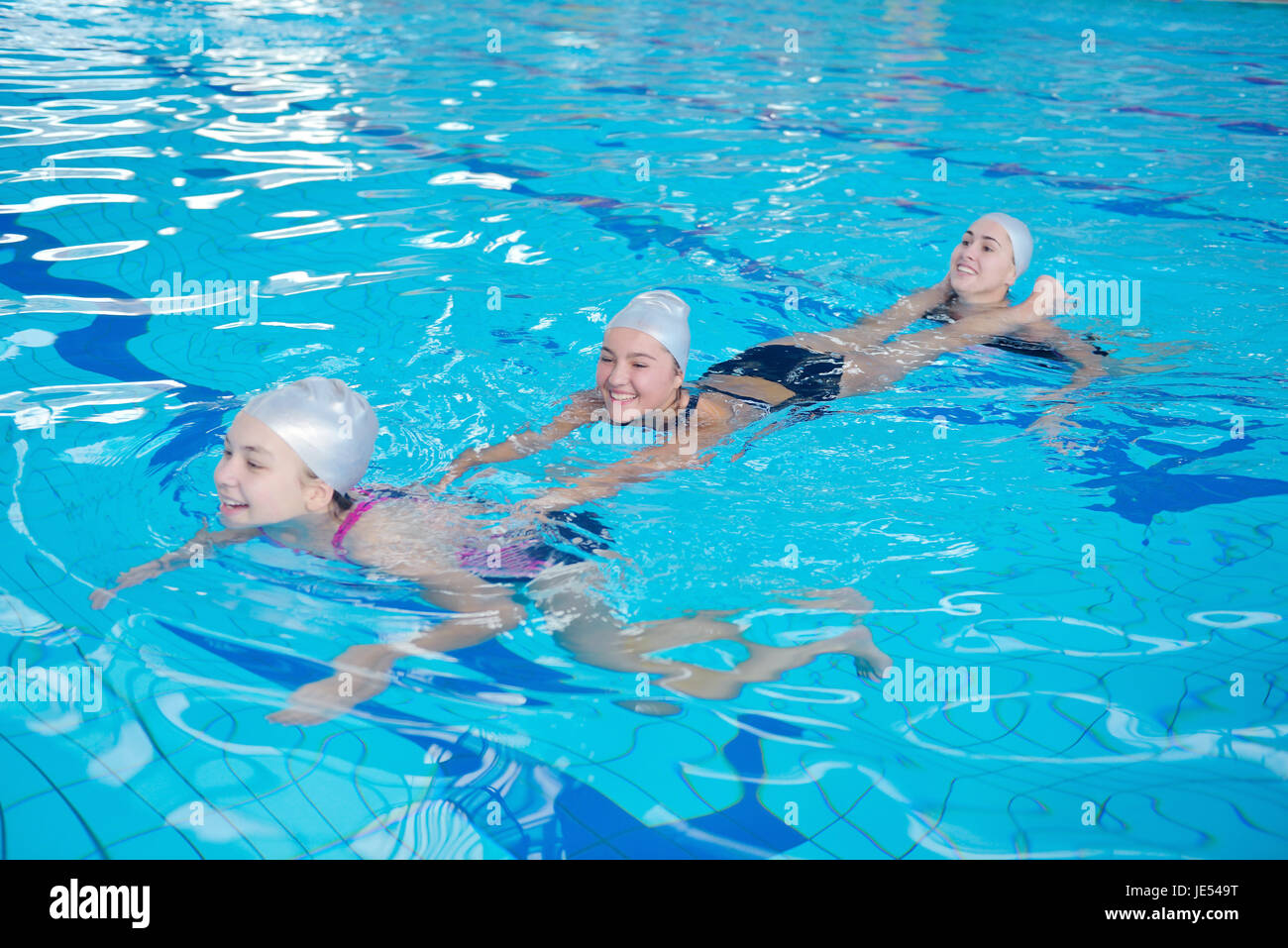 help and rescue action in swimming school at pool Stock Photo - Alamy