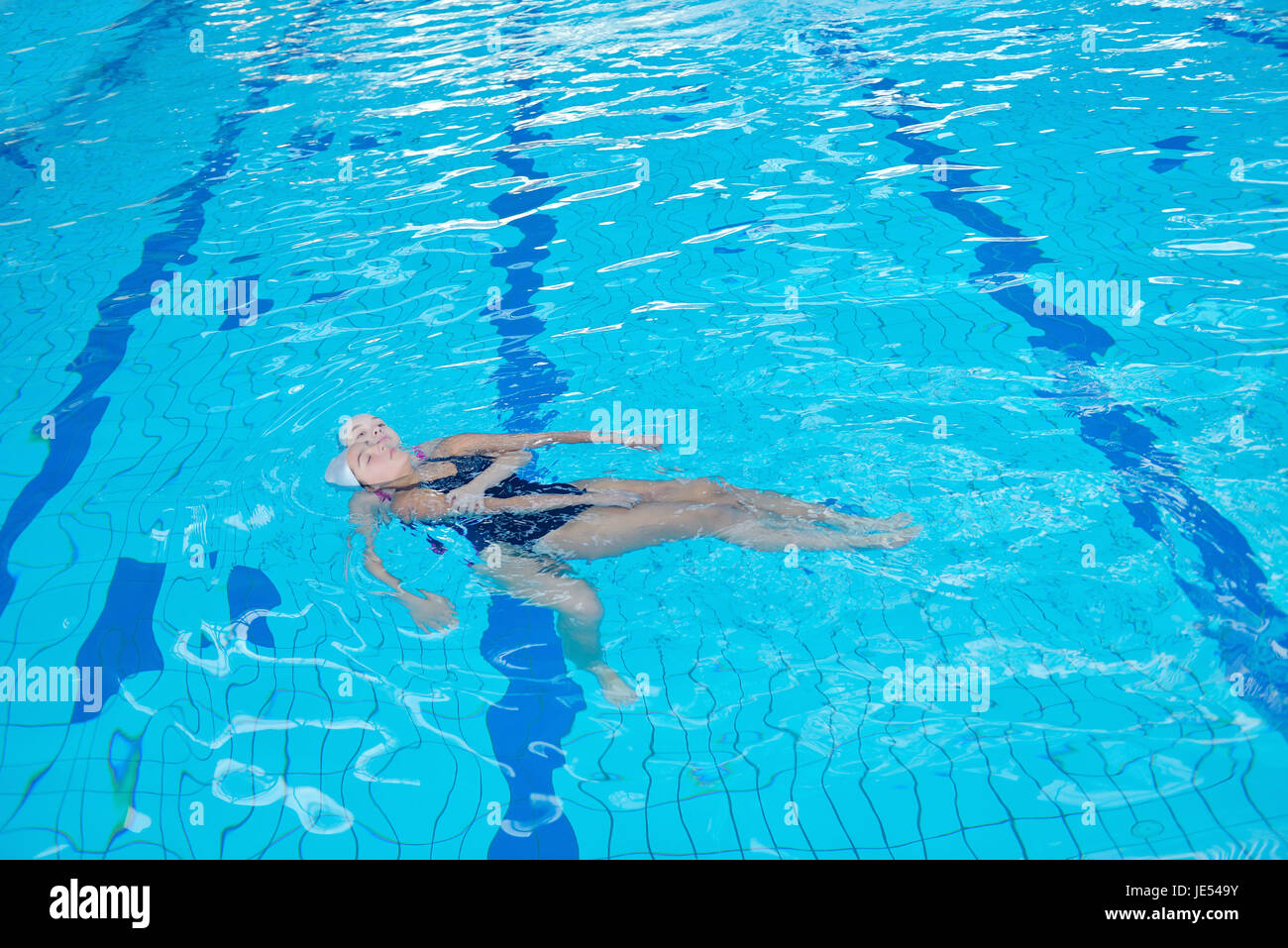 help and rescue action in swimming school at pool Stock Photo - Alamy
