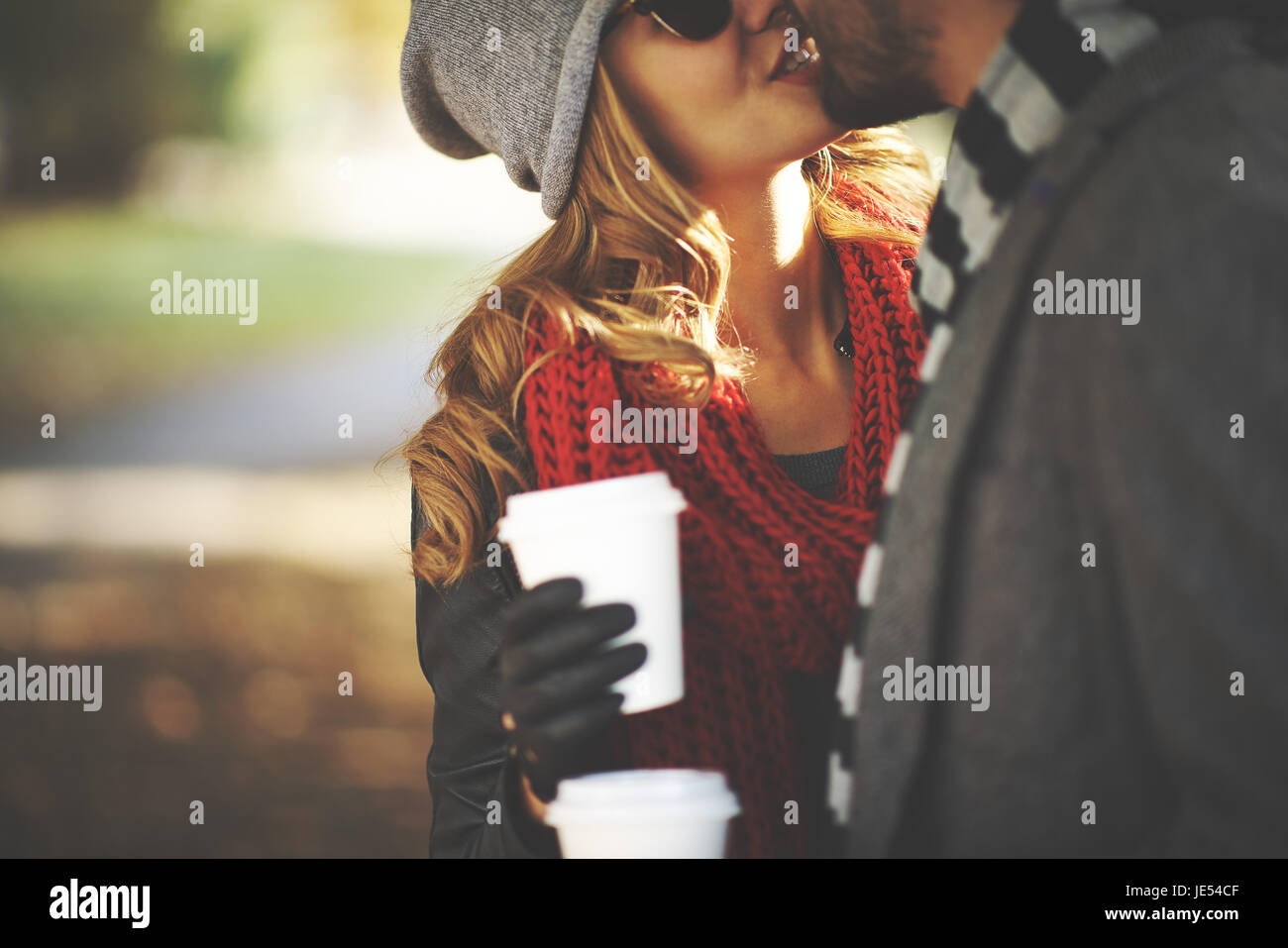 Young people kissing outdoors Stock Photo - Alamy
